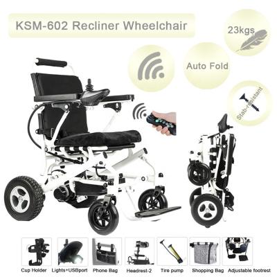 Cina KSM-602 Modern design foldable wheelchair travel lightweight folding electric wheelchair auto open and fold options in vendita