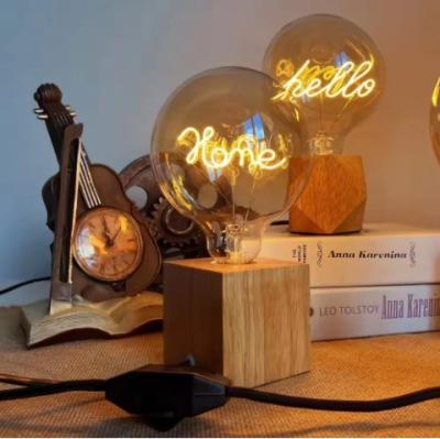 China LED Filament Bulb Happy Family Letter Bulb 0.2kg Unique Spiral LED Decorative Light for sale