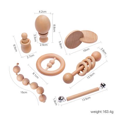 Cina Il grafico crepita 7Pc Teether di legno per l'anello mettente i denti di legno del bambino in vendita