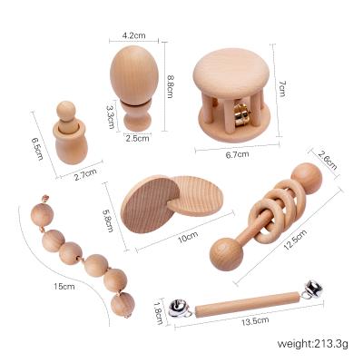 Cina Il grafico crepita 7Pc Teether di legno per l'anello mettente i denti di legno del bambino in vendita
