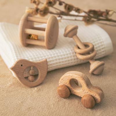 Cina 4 pc/bambini dell'insieme gioca il regalo neonato musicale di Teether di crepitio di legno naturale in vendita