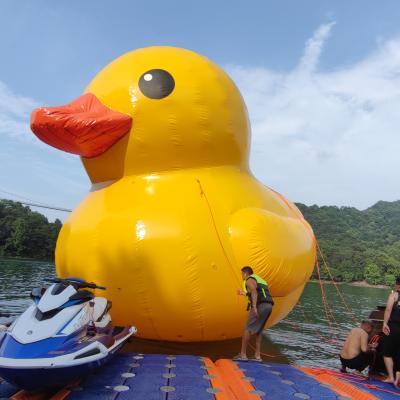 China Sleeping Inflatable Yellow Duck Floating on Water Huge Inflatable Cartoon for Advertising for sale
