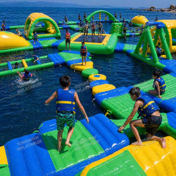 Quality Large Custom Inflatable Water Park With Floating Obstacle Course And Slide for sale