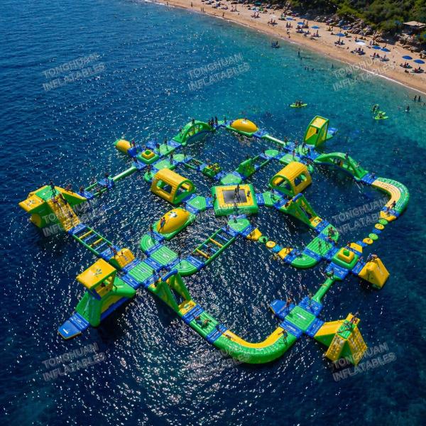 Quality Large Custom Inflatable Water Park With Floating Obstacle Course And Slide for sale