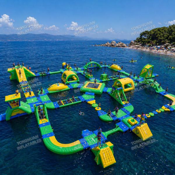 Quality Large Custom Inflatable Water Park With Floating Obstacle Course And Slide for sale