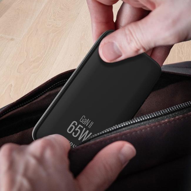 Side view of compact 65W charger with foldable plug