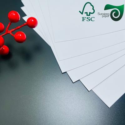 China 300gr 310gr Double Sided Glossy Cardboard Paper 70cm 100cm Kink Resistant for sale