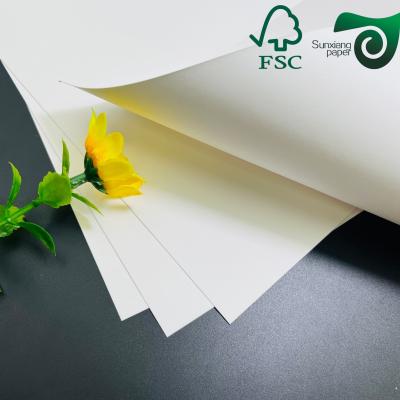 China 325gsm FSC Uniform White Coated Kraft Back Paper  Ideal For Premium Bread Packaging for sale