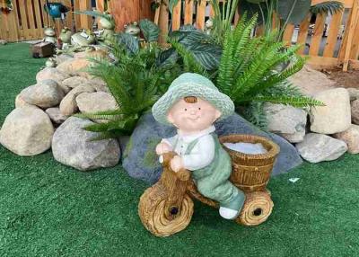 Cina La statua all'aperto del giardino dell'ossido di magnesio scolpisce i piccoli bambini che guidano la statua in vendita