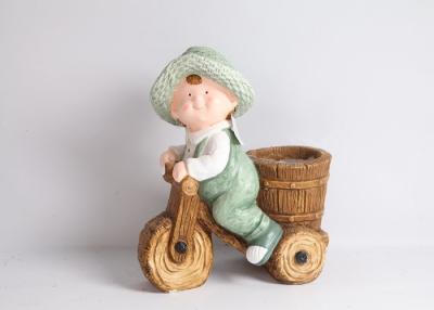Cina La statua all'aperto del giardino dell'ossido di magnesio scolpisce i piccoli bambini che guidano la statua in vendita