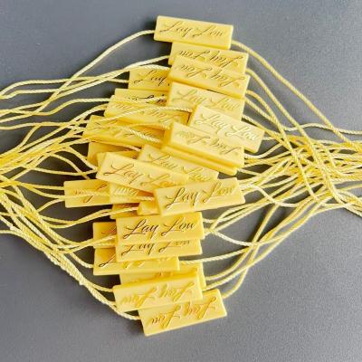 China Embossed Plastic Tag Fastener Eco Friendly Durable Plastic Texture Ideal for Secure Labeling Applications for sale