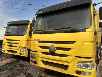 중국 노란색 시노트럭 HOWO 6*4 디젤 트럭 351-450hp 전면 리프팅 스타일 중고용 트럭 판매용