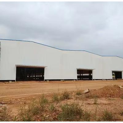 China Eco-Friendly Steel Structure Building with 50 Years Service Life Roller Shut Door and EPS Insulation for sale