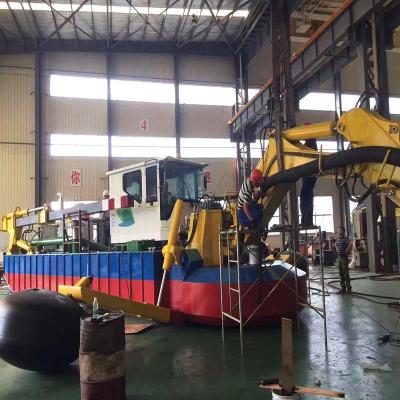 China Diesel Power Type Multipurpose Amphibious Bucket Dredger with 120m3-700m3/h Capacity for sale