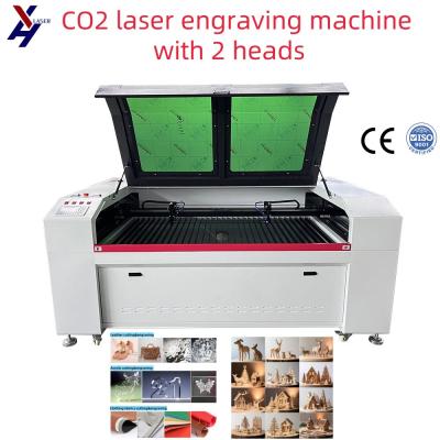 Cina Taglierina laser CO2 da 1600*1000mm 100W 150W con doppia testa 4 teste per legno acrilico gomma in vendita