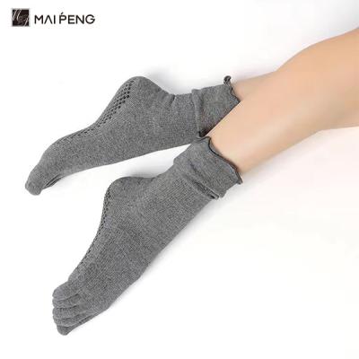 Cina Donne calze da yoga con manette a sfregamento non scivolante calze da pilates con presa a cinque dita in vendita