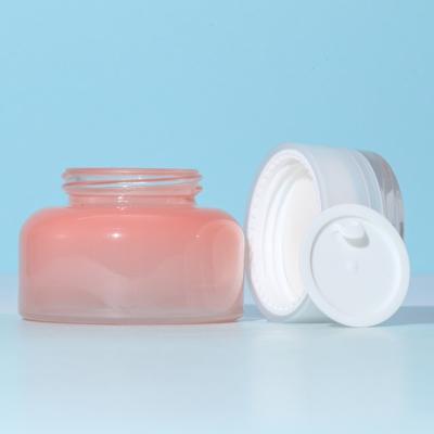 Cina cosmetici di lusso di 100ml 120ml che imballano il barattolo acrilico di vetro rosa della crema di fronte dell'essenza della lozione in vendita