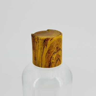 Cina 24/410 24mm Plastic Water Transfer Wood Grain Lotion Disco liquido di sapone Top Cap in vendita
