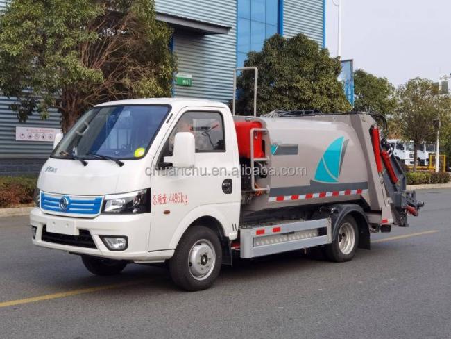 Side view of compression garbage truck