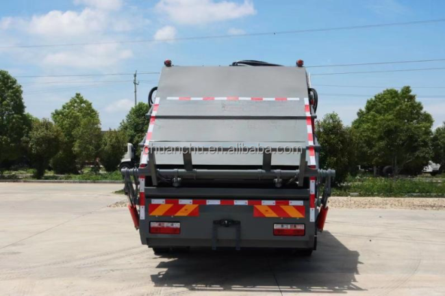 Compressed garbage truck in operation