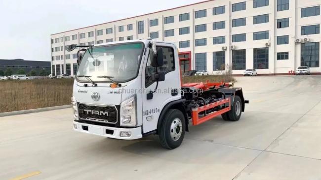 Hook arm garbage truck side view
