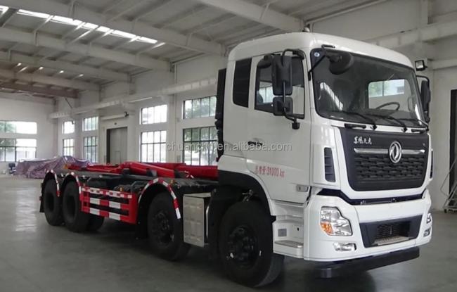 Hook arm garbage truck side view