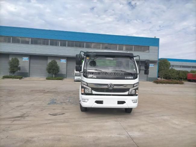 Pure electric garbage compactor truck side view