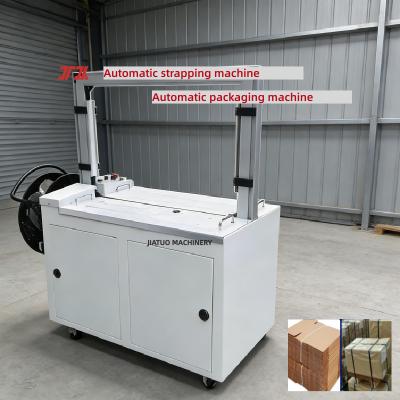 China High-speed automatic strapping machine Automatic packaging machine for strapping cardboard boxes for sale