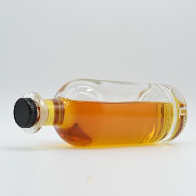 中国 XO/ブランデー スーパーフリントガラス素材とクラウンキャップのための700ml ユニークな形状のガラスボトル 販売のため