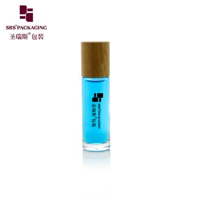 China Leak Proof Glass Bamboo Roll On Bottle 15ml Capacity Customizable Color Logo Anti Acne Skincare Roll On for sale