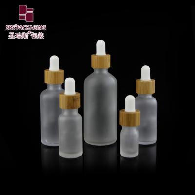 China Custom Frosted Essential Oil Empty Packaging 15ml 30ml 50ml 100ml Bamboo Dropper Bottle for sale