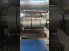 Steel coil leveling in progress