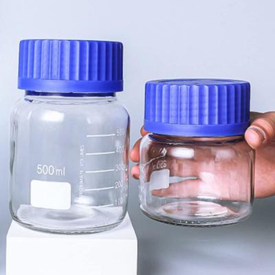China Grote mond gegradueerde ronde reagensmedia/opslaglaboratorium glasflesset met GL80 blauwe polypropyleen schroefkappen Te koop