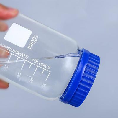 China Grote mond gegradueerde ronde reagensmedia/opslaglaboratorium glasflesset met GL80 blauwe polypropyleen schroefkappen Te koop