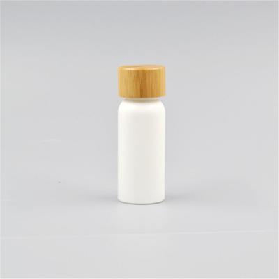 China Plastic 100% PLA biodegradable cosmetic packaging 30g50g100g compostable bottle with bamboo cap for sale