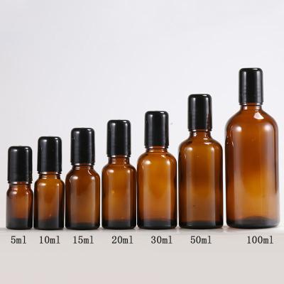 China Brown Glass Roll-on Bottles Empty Refillable Glass Roller Bottles with Stainless Steel Roller Balls for sale