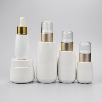 China Cosmetic luxury gold pump cap pet plastic skincare products packaging bottle set dropper /spray /cream /lotion bottle for sale