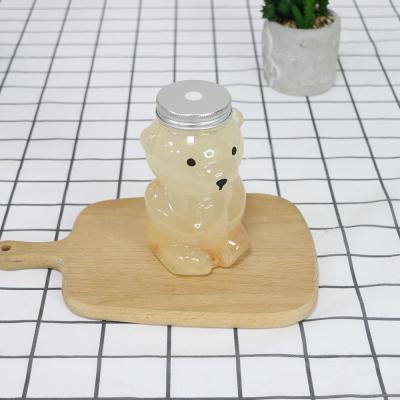 Cina Costo di spedizione Materiale di base per animali da compagnia Creativo in forma di orso Bottiglia di plastica a bolla con tappi in alluminio in vendita