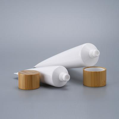 Cina 50g60g80g100g120g150g Pompa cosmetica con copertura in bambù Dispositivo e serigrafia in vendita