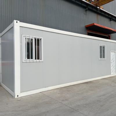 China 20 40 ft Customized Light Steel Frame Fiber Glass Roof Flat Pack Container House with Modern Design and Aluminum Window for sale
