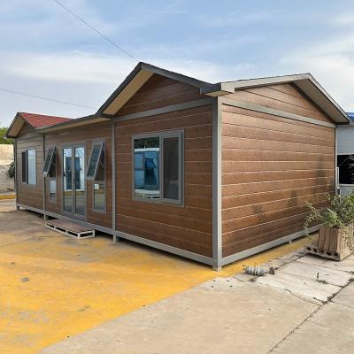 中国 プロフェッショナル プリファブリック リビング コンテナ ホーム 15-30 年の使用寿命と電熱鋼枠構造 販売のため