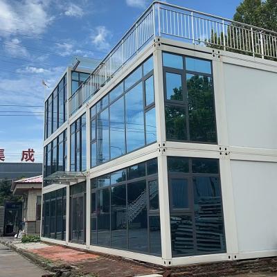 中国 PVC板床 二層モジュール型 移動式 20 40 フィート プレファブリケーション コンテナハウス ガラスカーテンとオフィス用の階段 販売のため