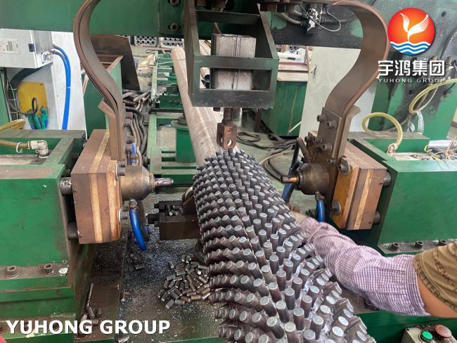 Studded fin tubes for industrial heat exchangers showing detailed fin structure