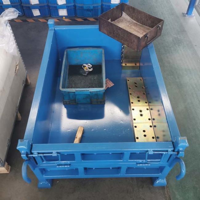 Stackable grid metal pallet bins in warehouse setting