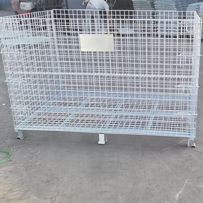 Foldable wire mesh storage cage in warehouse setting