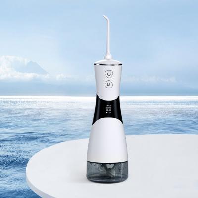 Cina Grande esposizione LCD di nuovo arrivo con 5 il flosser orale dell'acqua del serbatoio di acqua di cura 350ml di punte di modi 6 in vendita