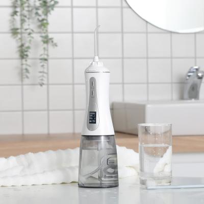 China Tempos impermeáveis orais dentais portáteis elétricos de 5V Irrigator 1800/minuto à venda