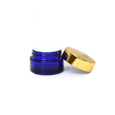 Cina Barattolo di vetro dei cosmetici blu di Hanya Glass Lotion Bottles 30g 50g in vendita