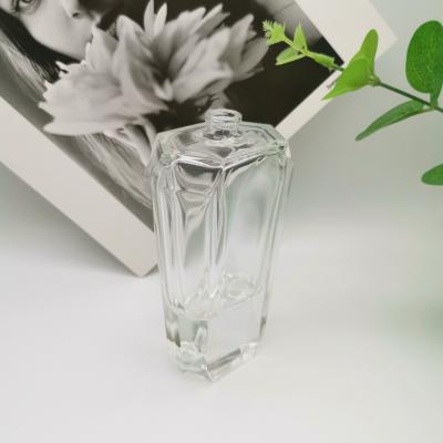 China Flat Shoulder Clear Glass Perfume Spray Bottles 30ml 50ml 100ml for sale
