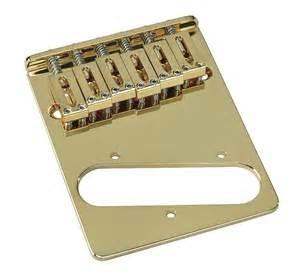 China china CNC Machined Parts of Gold Plated Bass Bridge Plate for Guitar Fittings manufacturer for sale